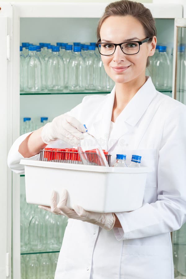 Worker of lab holding box stock photo. Image of professional - 45472774
