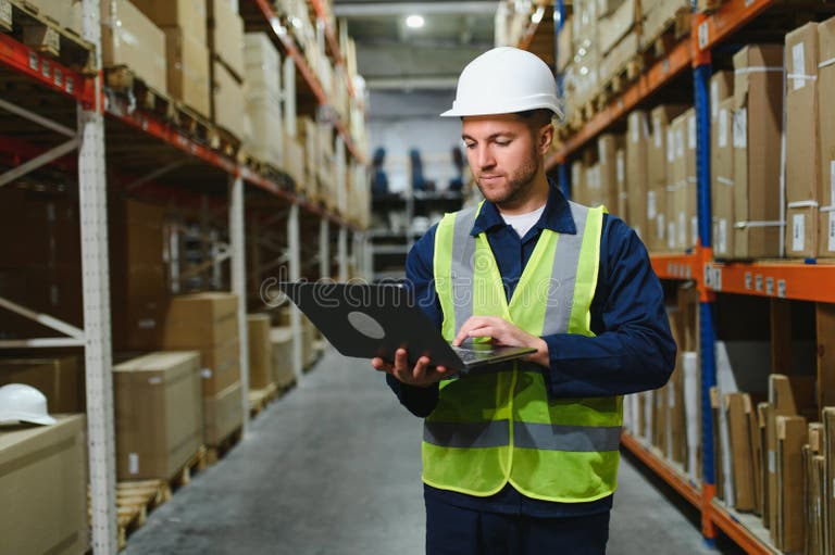Worker with Laptop Computer in Mail Order Warehouse Stock Image - Image ...