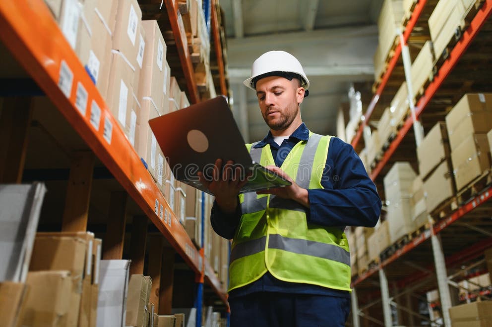 Worker with Laptop Computer in Mail Order Warehouse Stock Photo - Image ...