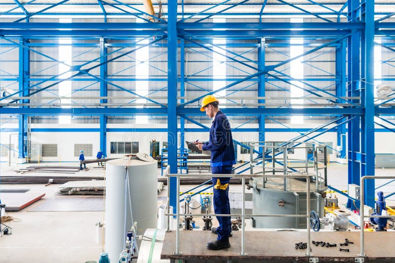 Worker in Large Metal Workshop Checking Work Stock Image - Image of ...