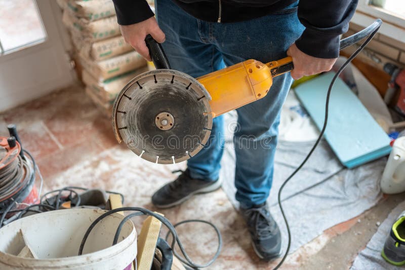 Worker with Large Radial Cutting Machine To Cut Walls and Floors. Stock ...