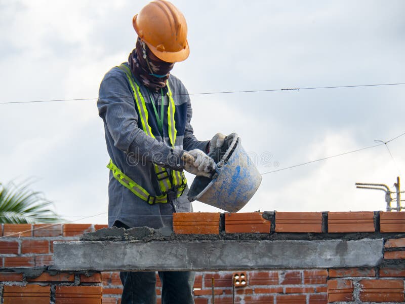 Worker Laying Brick at Construction Site. Masonary Work, Architectural ...