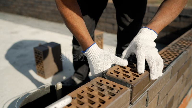 Worker Laying Bricks, Close-up. a Close-up of Construction Workers ... Worker Laying Bricks, Close-up. a Close-up of Construction Workers ...