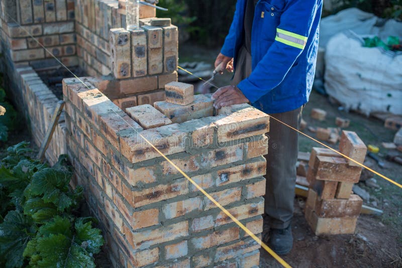 Cropped Shot of Worker Laying Bricks for Wall Stock Photo - Image of ...