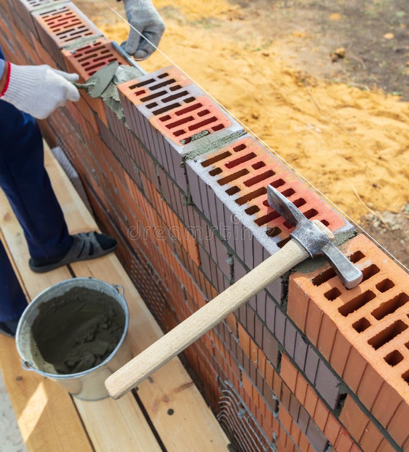The Worker Lays Bricks on the Wall of the House Stock Image - Image of ...