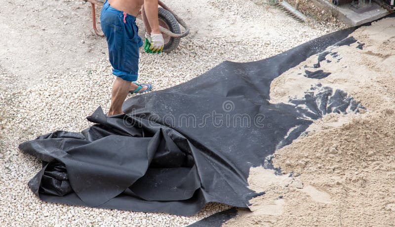 A Worker Lays Down Sand for Paving Slabs. Stock Image - Image of floor ...