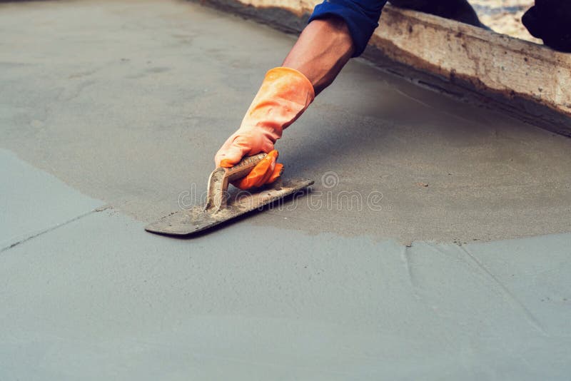 Worker Leveling Concrete Pavement for Mix Cement at Construction Stock ...
