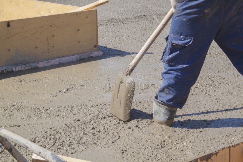 Worker Leveling Fresh Concrete Slab with a Special Working Tool Stock ...