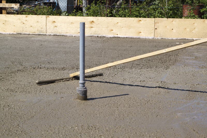 Worker Leveling Fresh Concrete Slab with a Special Working Tool Stock ...