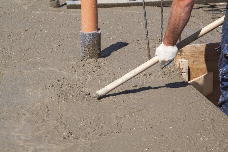 Worker Leveling Fresh Concrete Slab with a Special Working Tool Stock ...