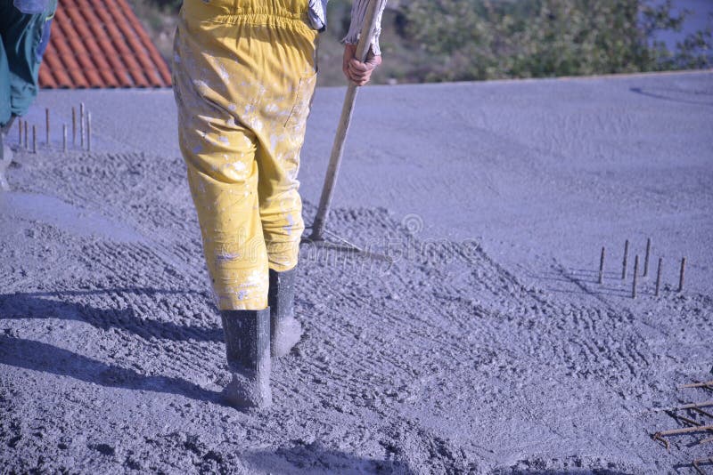 Worker Levelling Concrete stock image. Image of pouring - 41782845