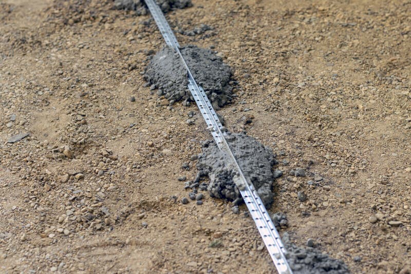 Floor Construction - Human Leveling of Concrete Screed Stock Image ...