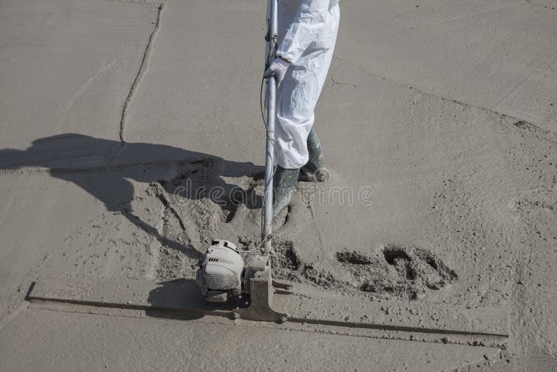 A Worker Levels the Concrete Surface of the Basement Stock Photo ...