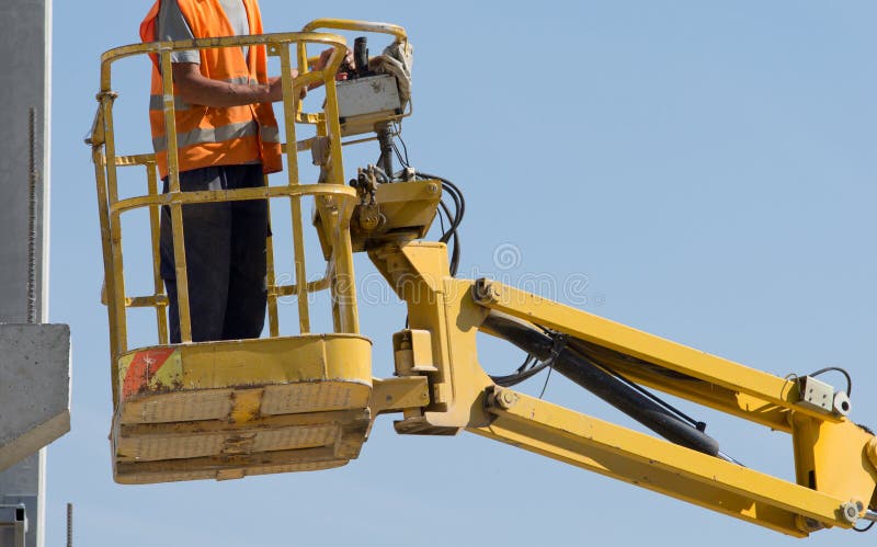 Worker in lifting platform stock image. Image of device - 60461935