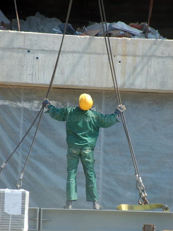 Worker with lifting ropes stock image. Image of fitting - 769897