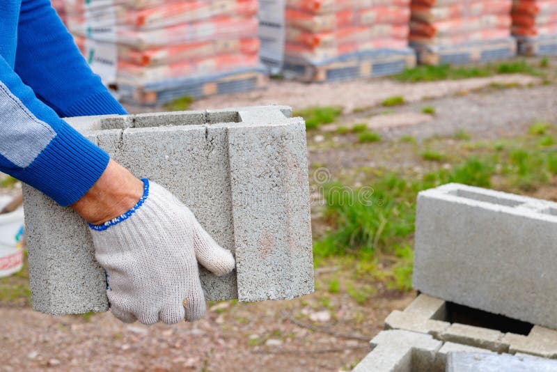 Worker Loads Cinder Blocks from Cement Slurry for Construction Stock ...