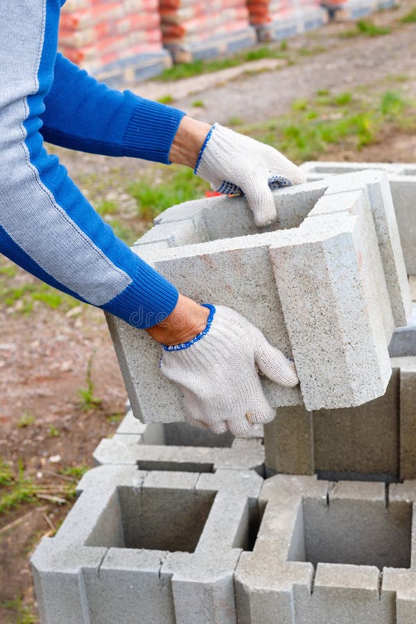 Worker Loads Cinder Blocks from Cement Slurry for Construction Stock ...