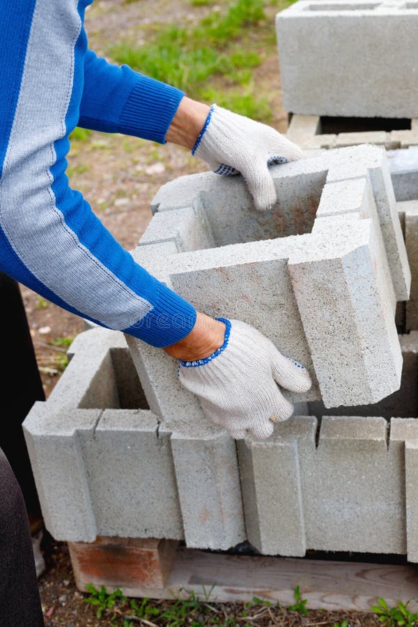 Worker Loads Cinder Blocks from Cement Slurry for Construction Stock ...
