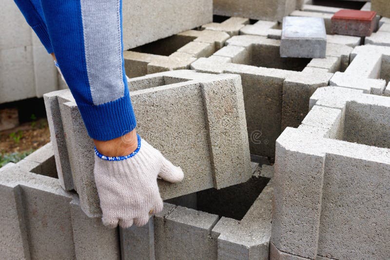 Worker Loads Cinder Blocks from Cement Slurry for Construction Stock ...