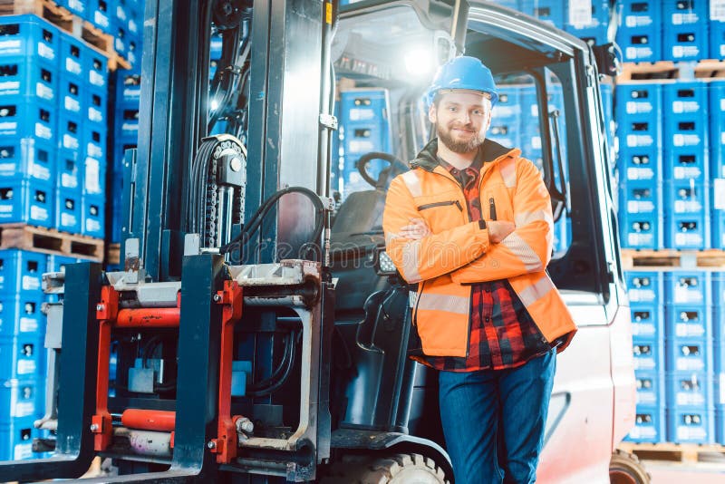 Worker in Logistics Distribution Center with His Forklift Stock Image ...
