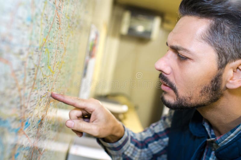 Worker looking at map stock photo. Image of container - 95597566