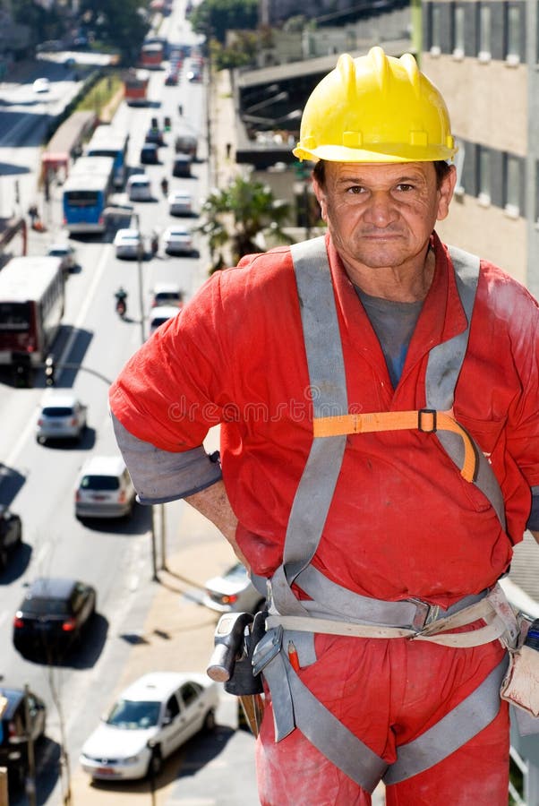 Worker Looks at Camera - Vertical Stock Image - Image of person, orange ...