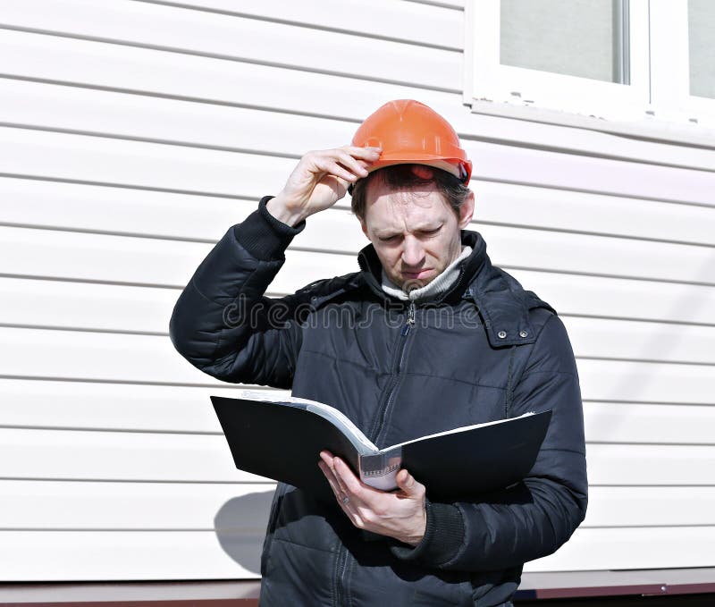 Worker Looks at the Drawing and Compares the Work Done Stock Photo ...