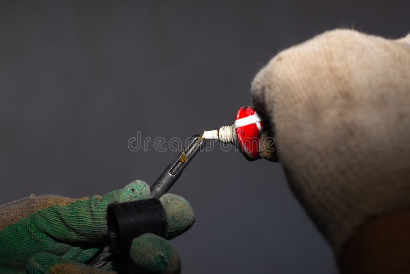Worker Lubricates the Iron Drill of the Drill with Oil Technical ...