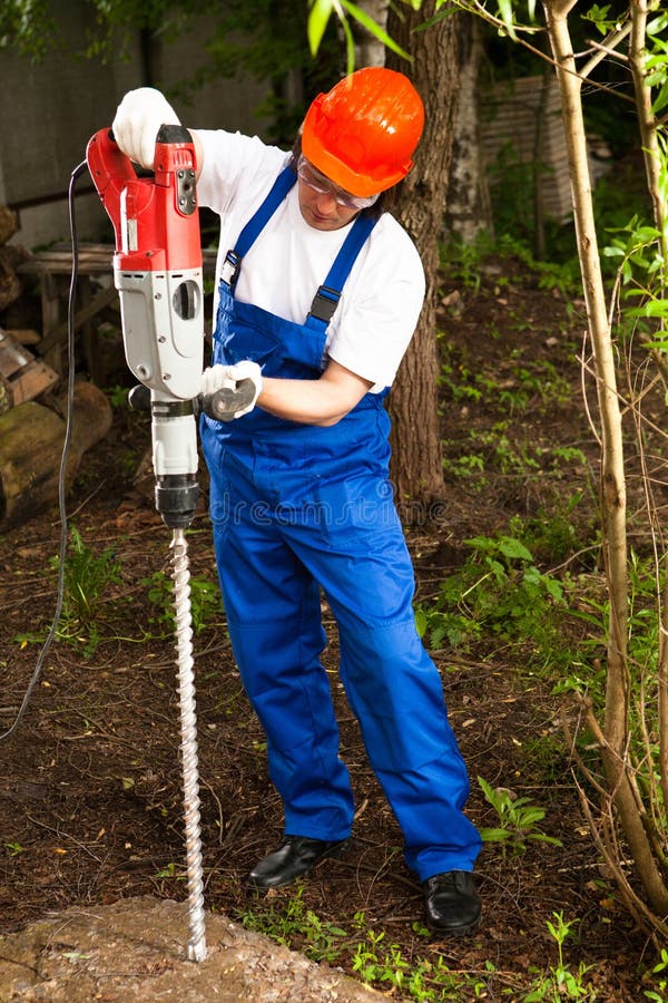 Worker with a Machine Drill Stock Photo - Image of tool, service: 16597326