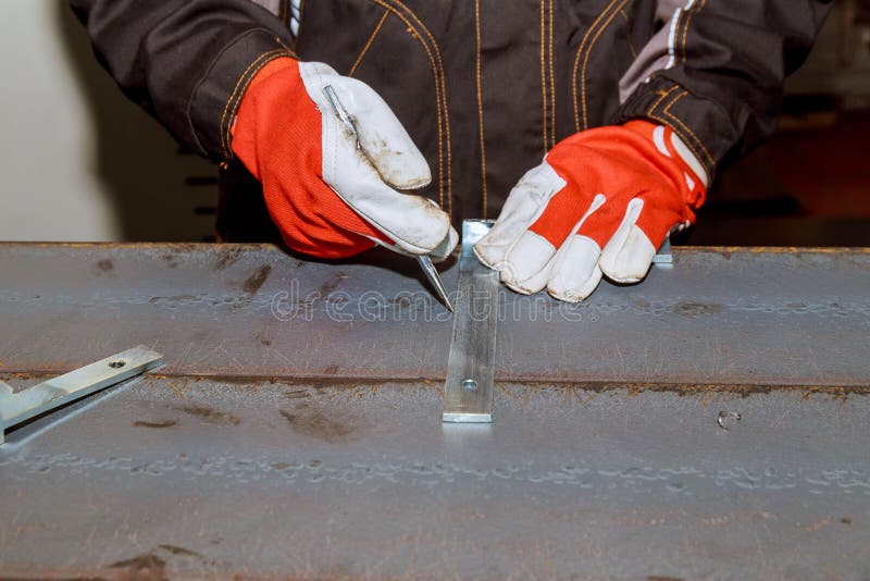 The Worker Makes a Mark on a Metal Surface by Means of Measuring Square ...