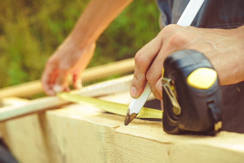 The Worker Makes Measurements with a Tape Measure Stock Image - Image ...
