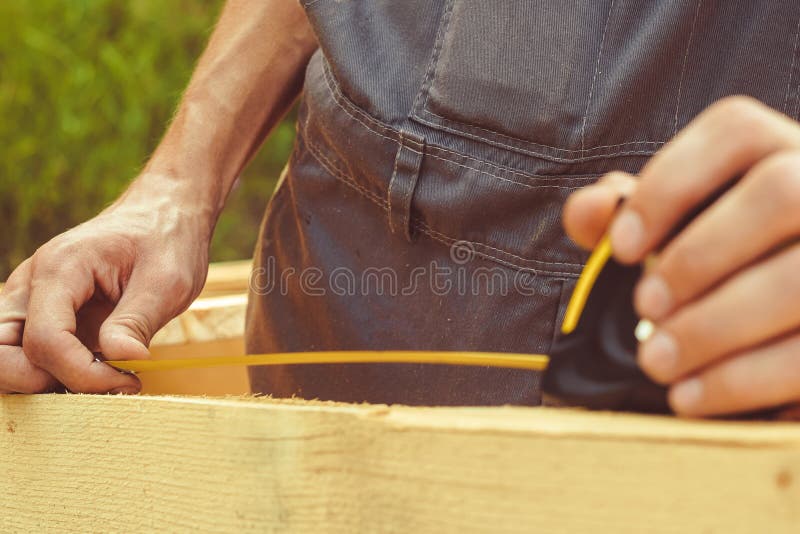 The Worker Makes Measurements with a Tape Measure Stock Image - Image ...
