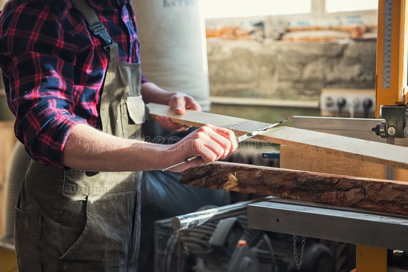 The Worker Makes Measurements of a Wooden Board Stock Image - Image of ...