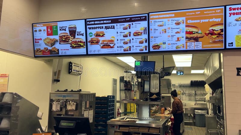 Worker Making Burgers for the Customer Inside Burger Kings Stock ...