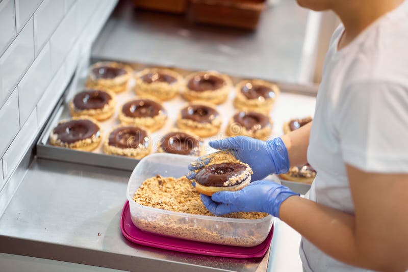 A Worker Making Delicious Donuts in a Candy Workshop. Pastry, Dessert ...