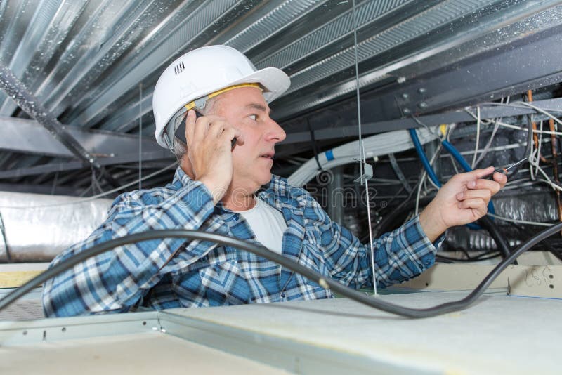 Worker Making Mounting for Electric Cable in Ceiling Stock Image ...