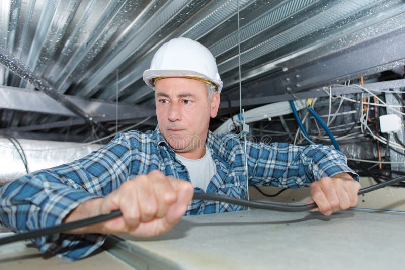 Worker Making Mounting for Electric Cable in Ceiling Stock Photo ...