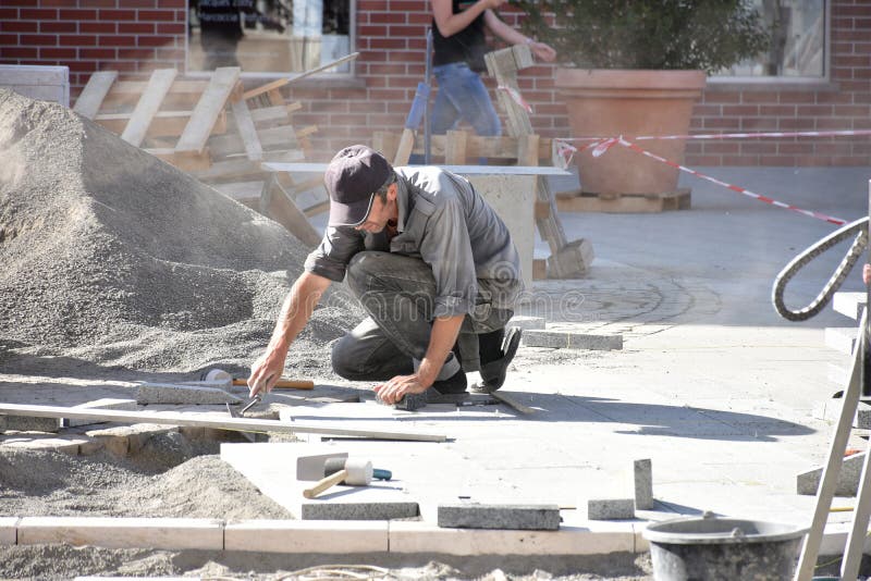 Worker Making the Pavement of Stone Blocks Stock Photo - Image of ...