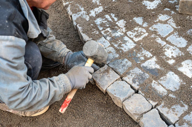 Worker Making the Pavement of Stone Blocks Stock Photo - Image of ...