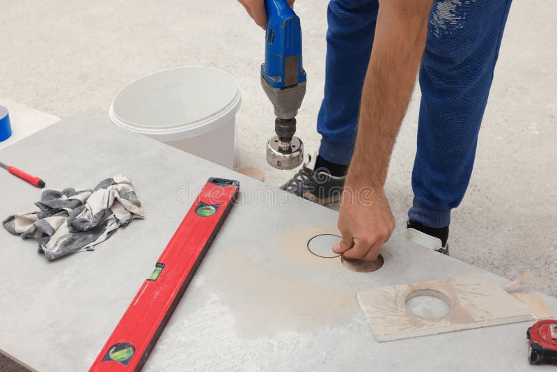 Worker Making Socket Hole in Tile Indoors, Closeup Stock Photo - Image ...