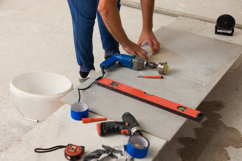 Worker Making Socket Hole in Tile Indoors, Closeup Stock Image - Image ...