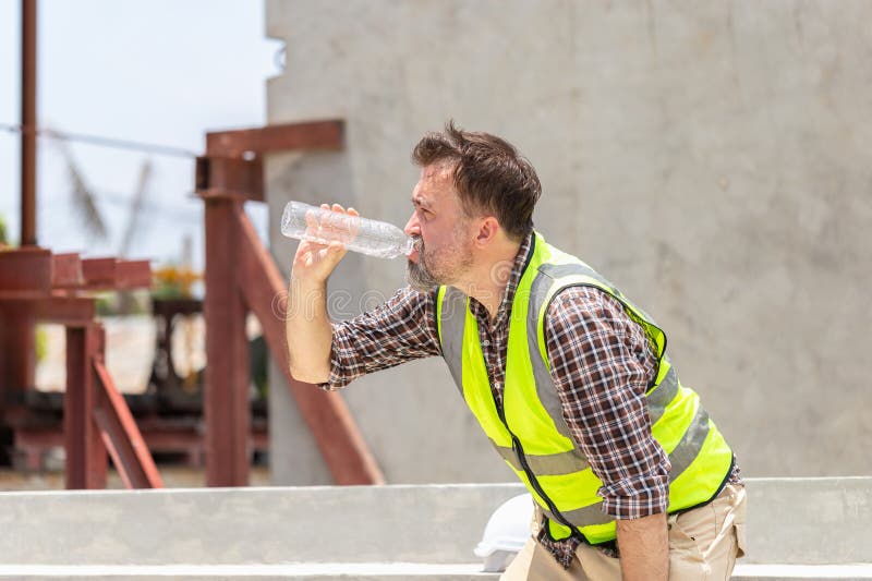 Worker Man in Hardhat Drinking Water at Container Cargo, Engineer Man ...