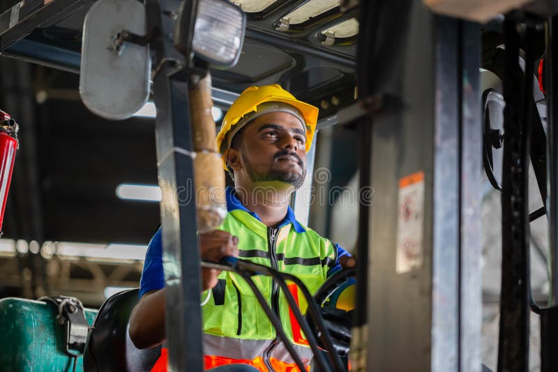 Worker Man in Hardhat and Safety Vest Driving Forklift for Control ...