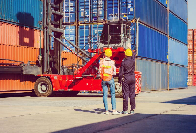 Worker Man in Hardhat and Safety Vest Holding Laptop and Female Foreman ...