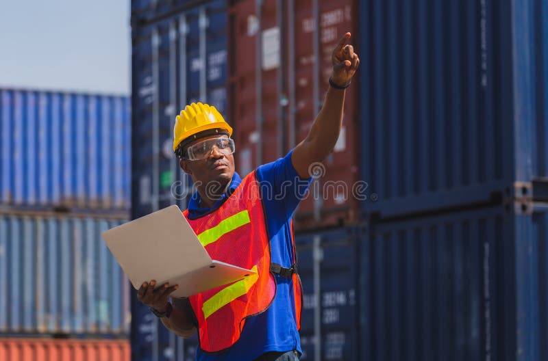Worker Man in Hardhat and Safety Vest Holding Laptop and Point To the ...