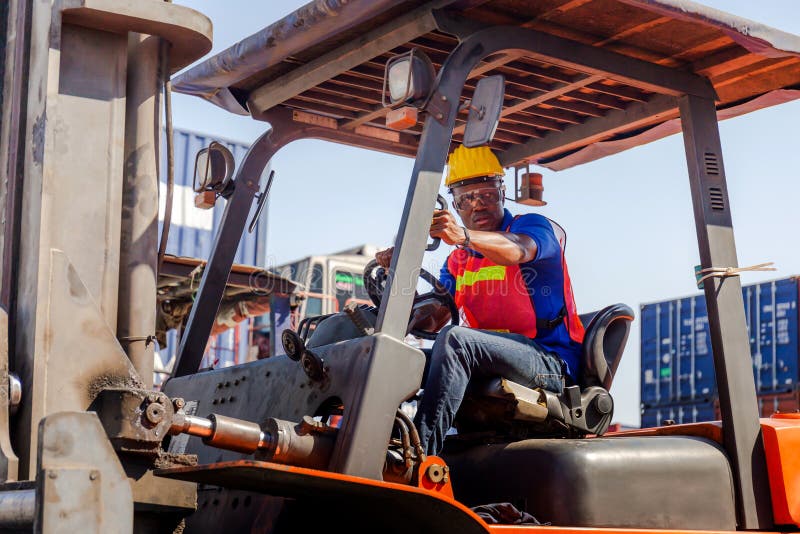 Worker Man in Hardhat and Safety Vest Sitting in Container Stackers ...