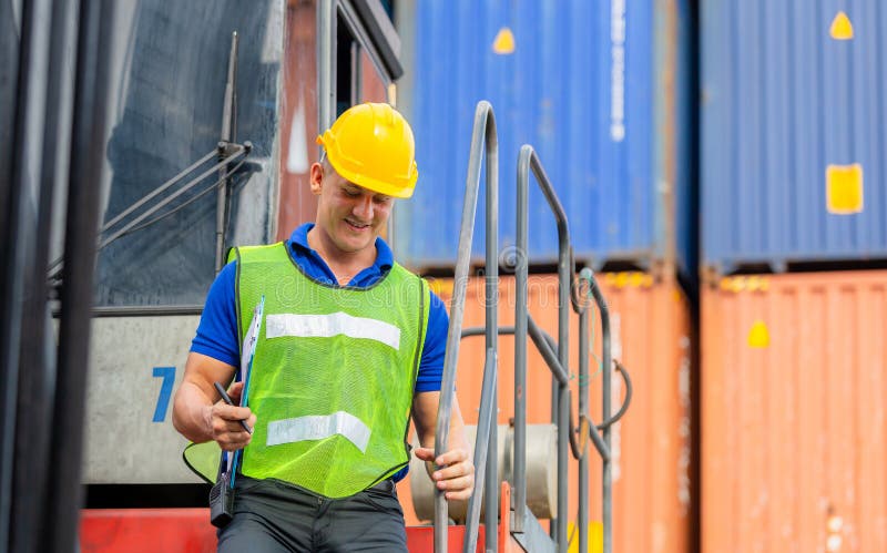 Worker Man in Hardhat and Safety Vest Standing on Container Stackers ...