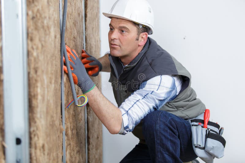 Worker Man Installing Thermal Insulation Layer with Mineral Rock Wool ... Worker Man Installing Thermal Insulation Layer with Mineral Rock Wool ...