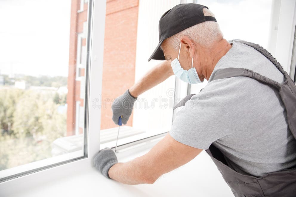 Worker Man Installs Plastic Windows and Doors with Double-glazed White ...