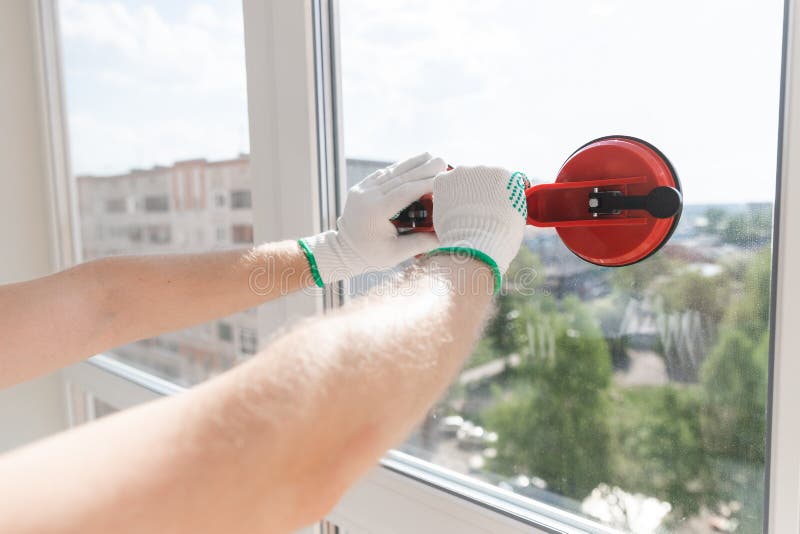 Worker Man Installs Upvc Plastic Windows Using Suction Cup Stock Photo ...